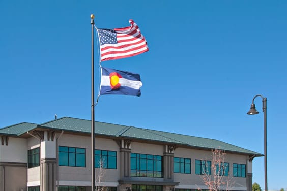 Pinnacle building’s new flag pole and signage | The Castle Pines Connection